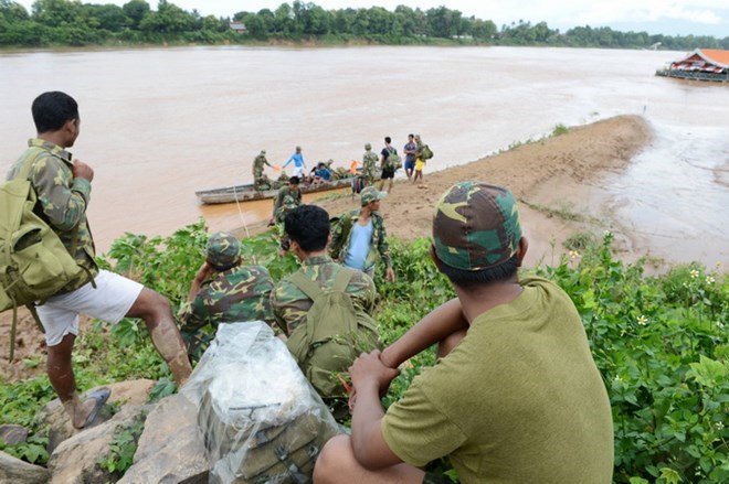Laos dam collapse: rescuers searching for missing victims Laos dam collapse: rescuers searching for missing victims